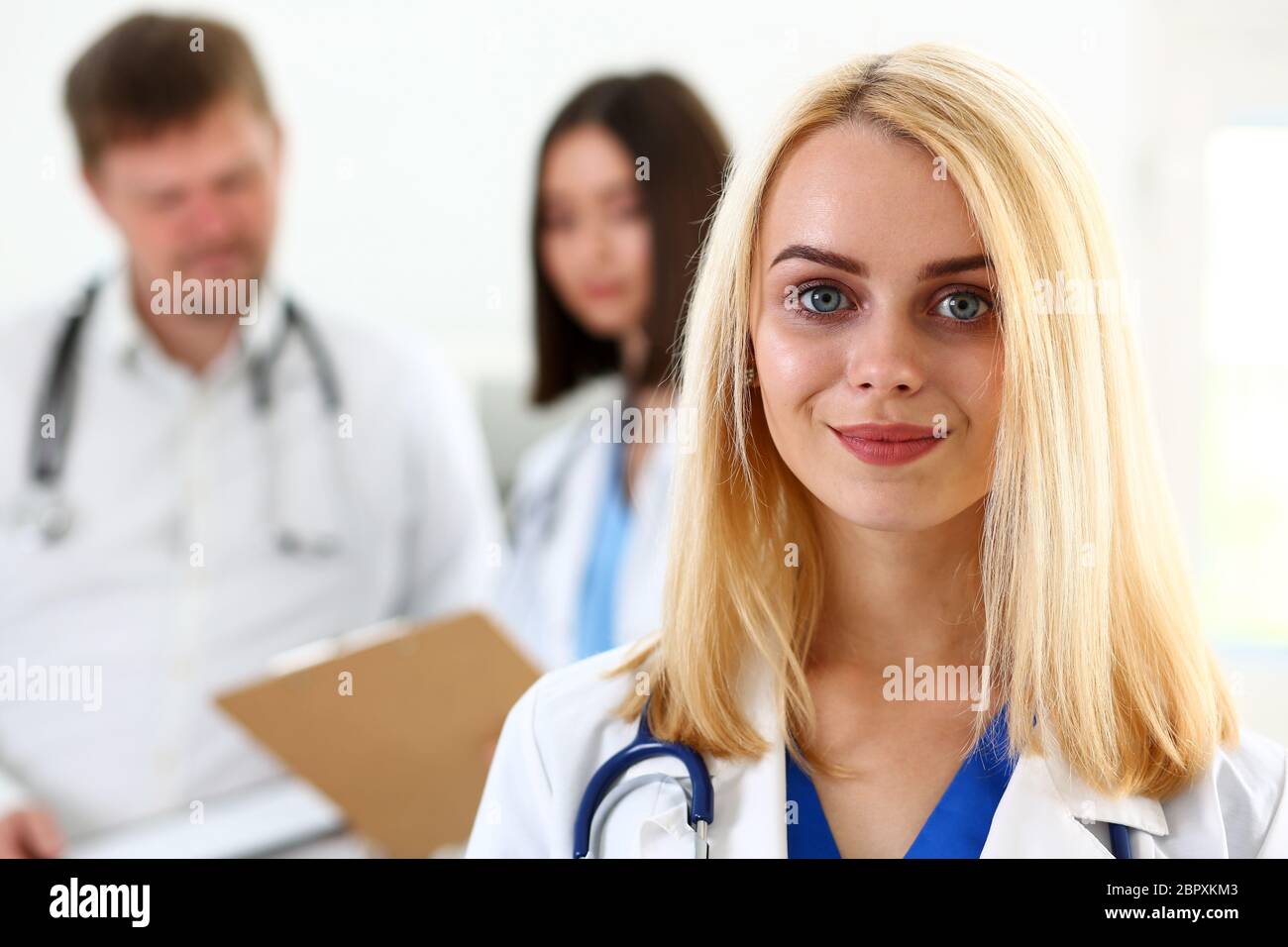 Beautiful smiling female doctor stand in office portrait Stock Photo ...