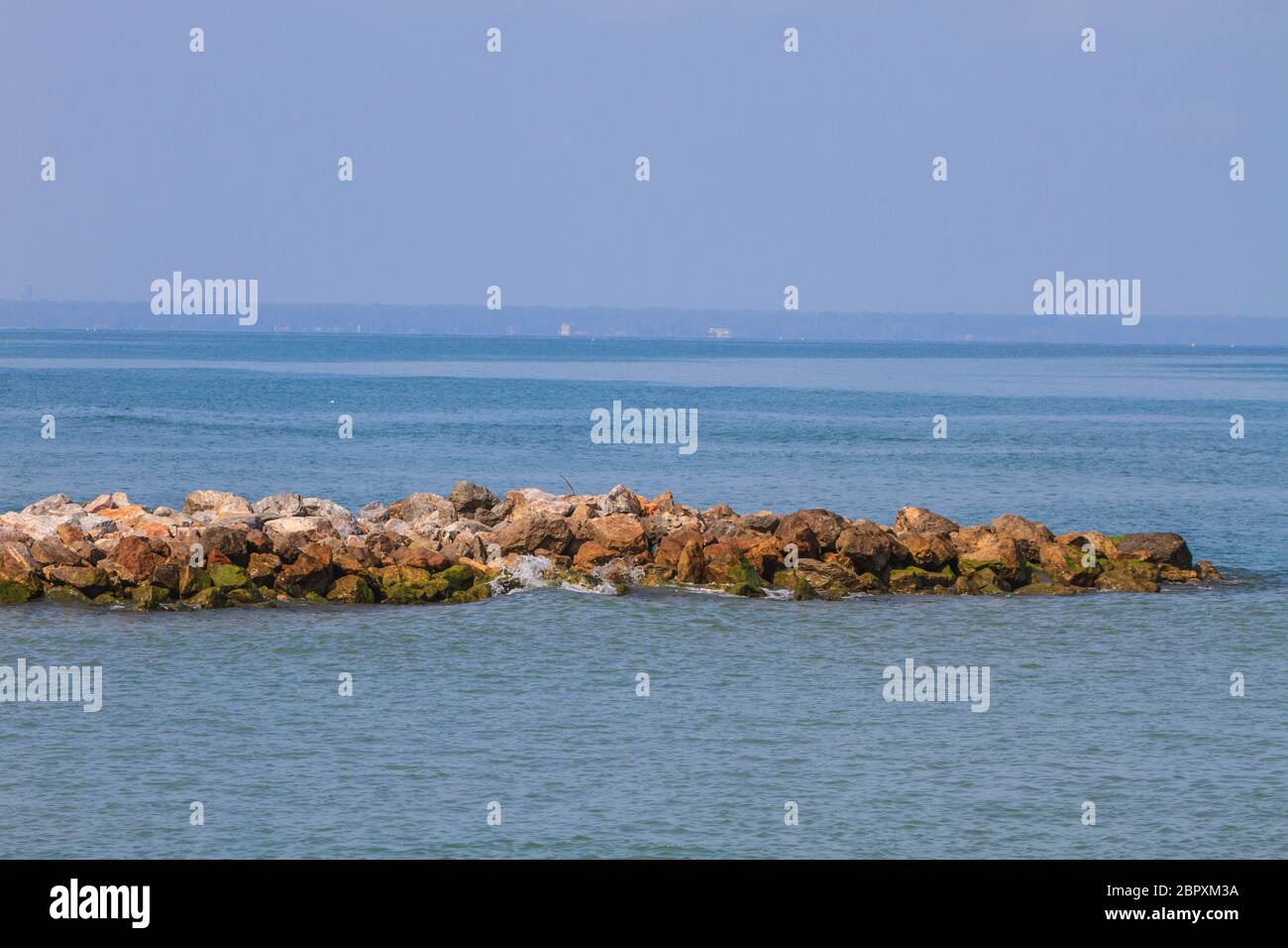 Rock breakwater, Cobble stone mole in sea Stock Photo - Alamy