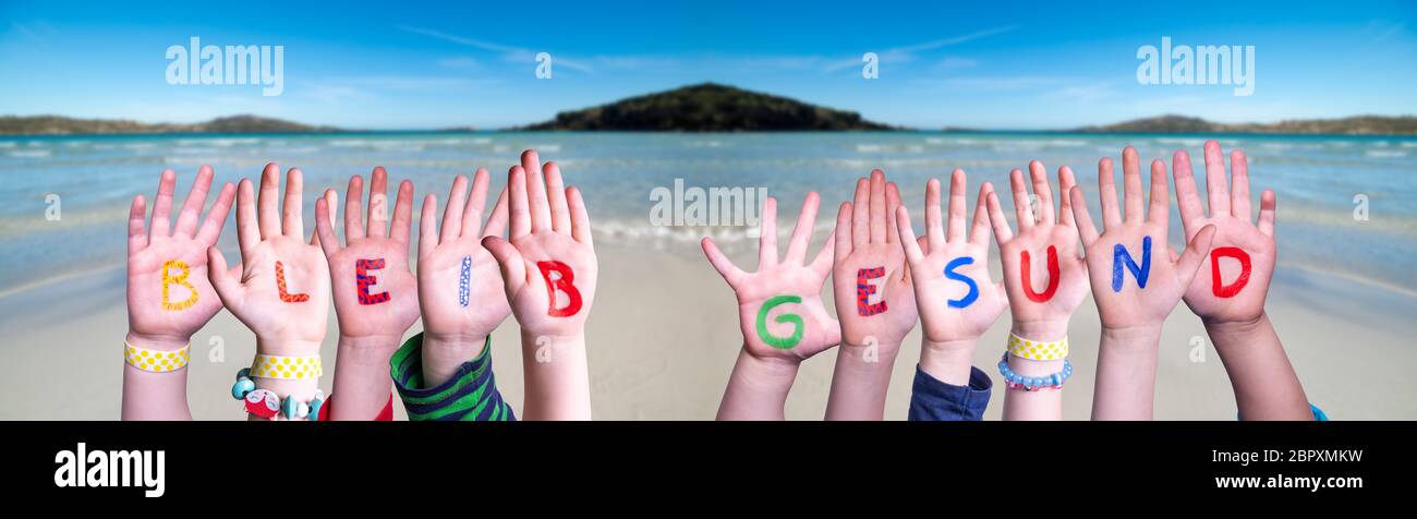 Kids Hands Holding Word Bleib Gesund Means Stay Healthy, Ocean ...
