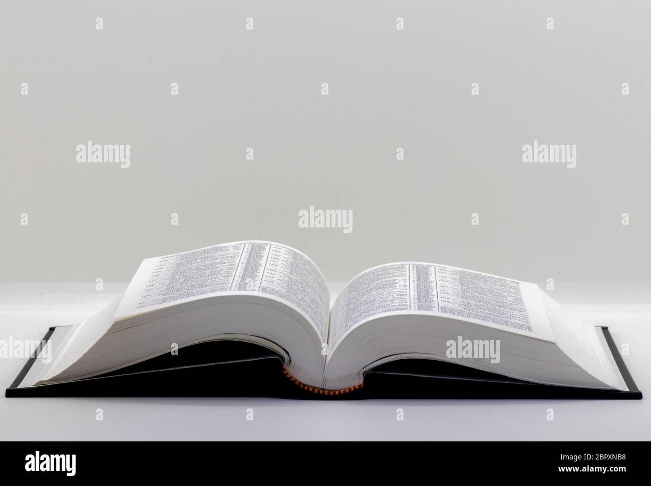 Open book isolated on white background Stock Photo - Alamy