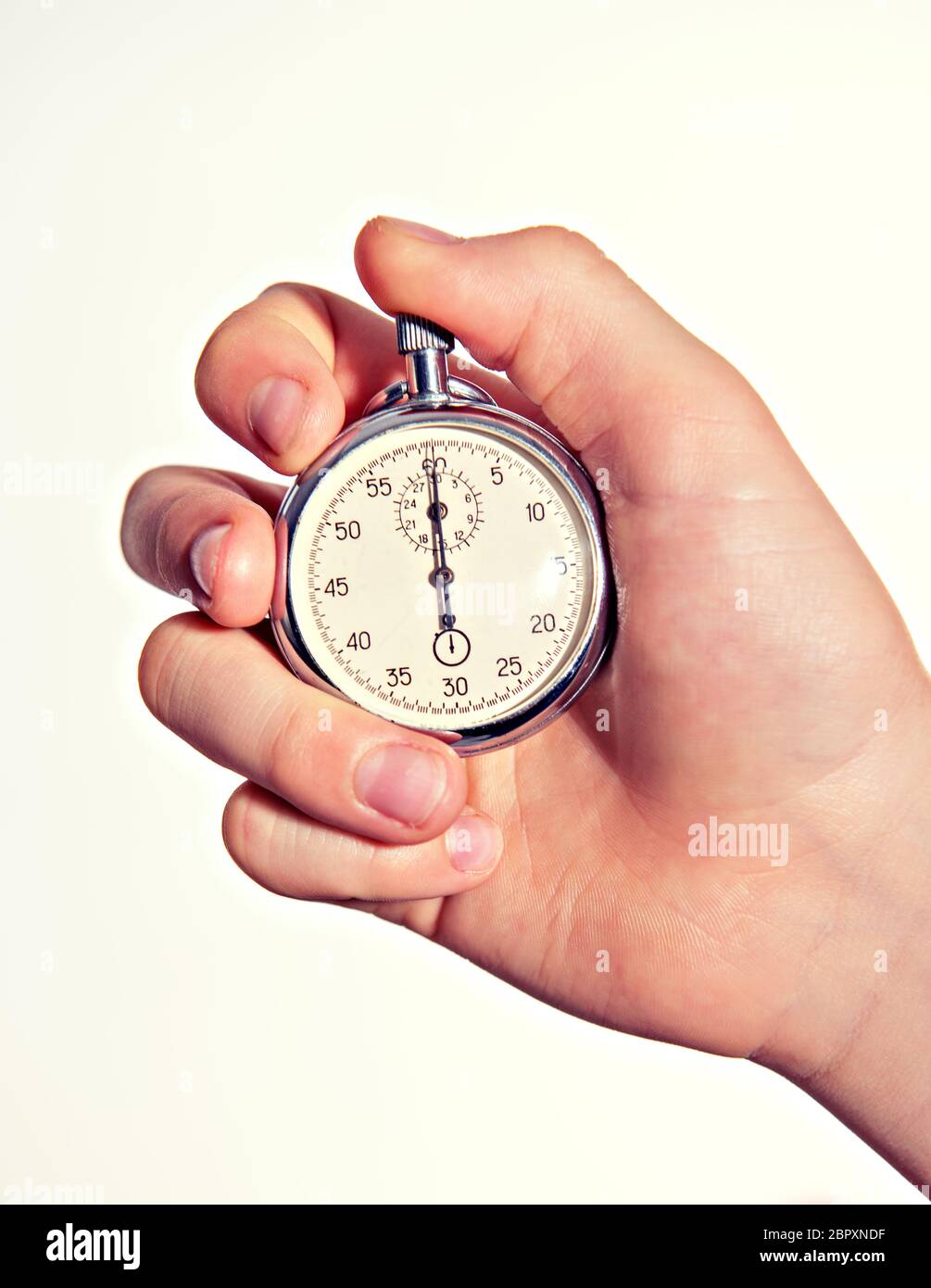 hand with stopp watch in front of white background Stock Photo - Alamy