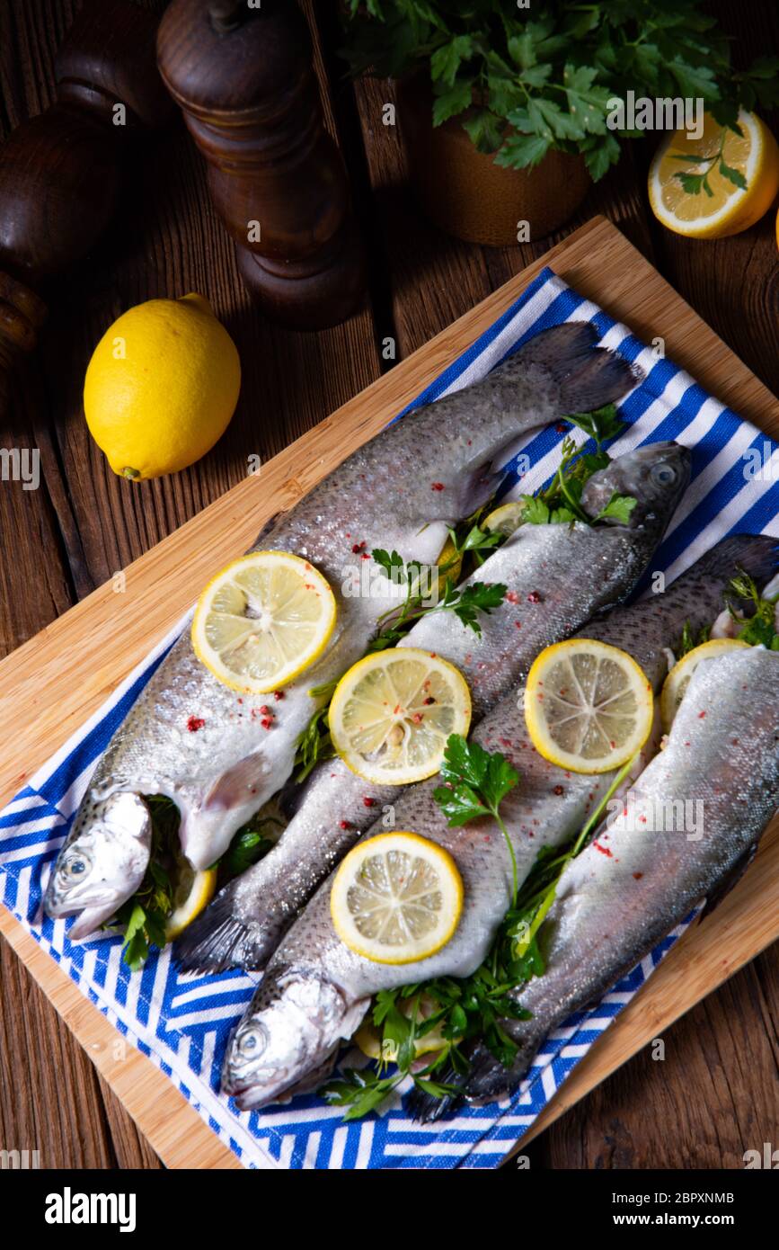 fresh trout with lemon and different herbs Stock Photo - Alamy