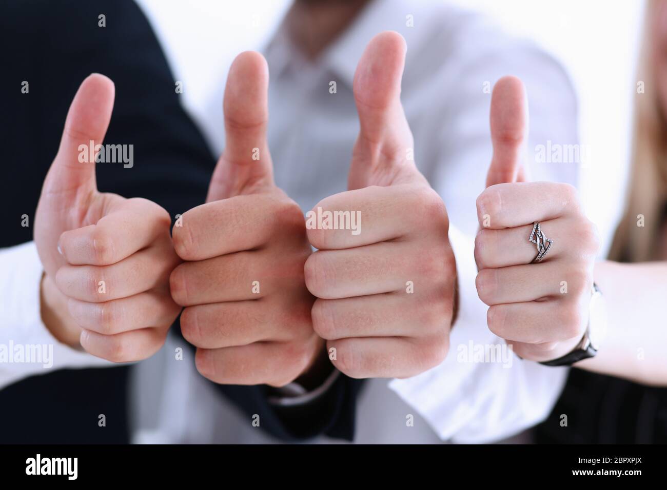 Group of people showing OK or approval sign with thumb up Stock Photo ...