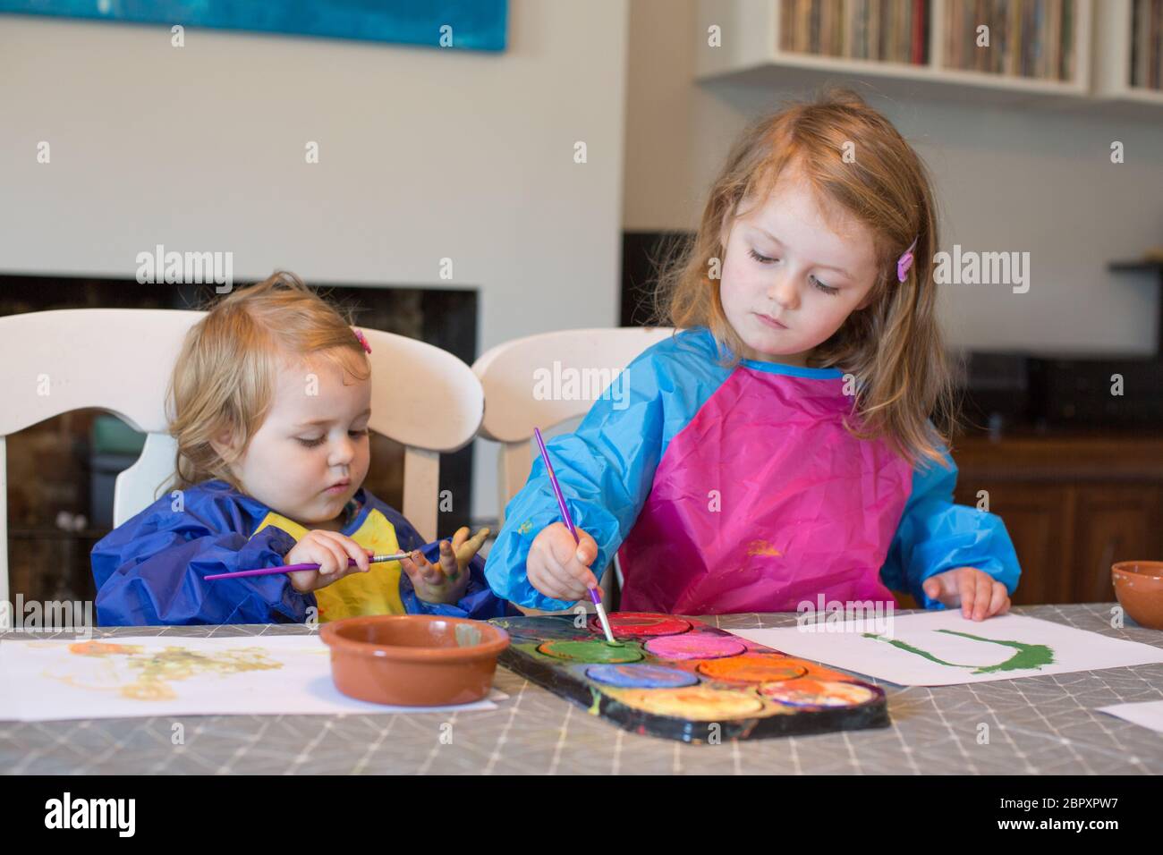 Children colouring and painting Stock Photo - Alamy