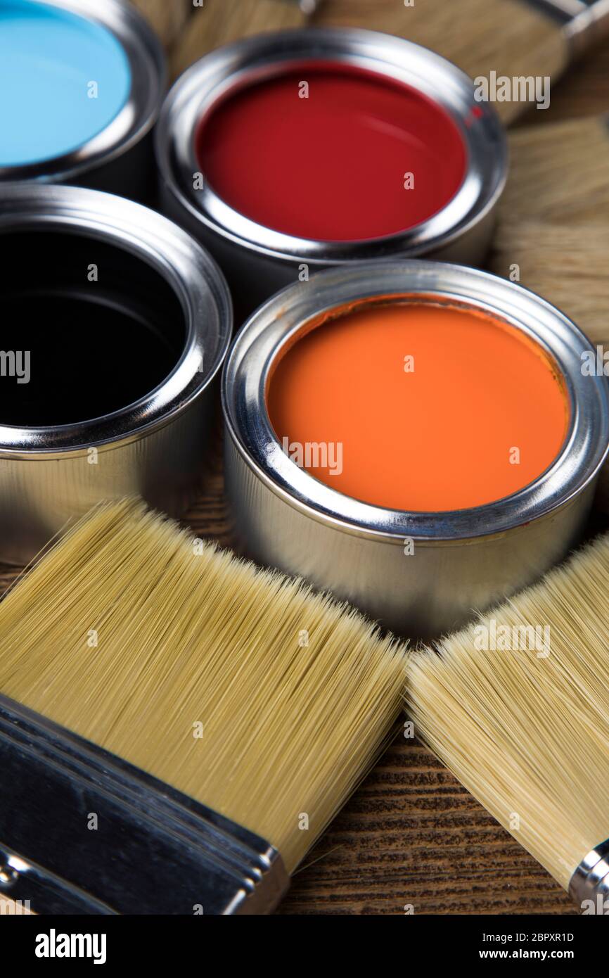 Metal tin cans with color paint and paintbrush Stock Photo - Alamy