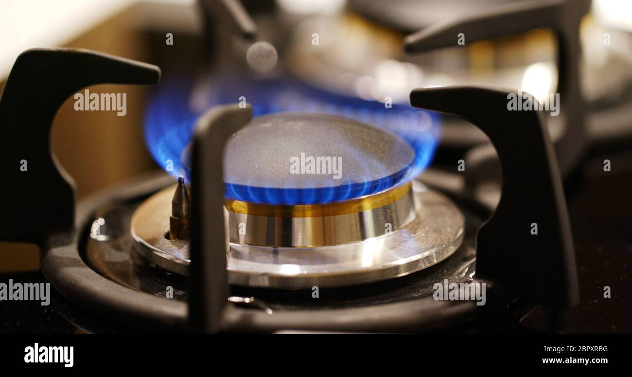 Gas burner on the stove in the kitchen Stock Photo - Alamy