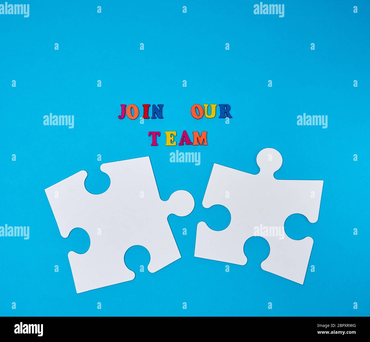 paper blank white puzzle on a blue background, the inscription join our ...