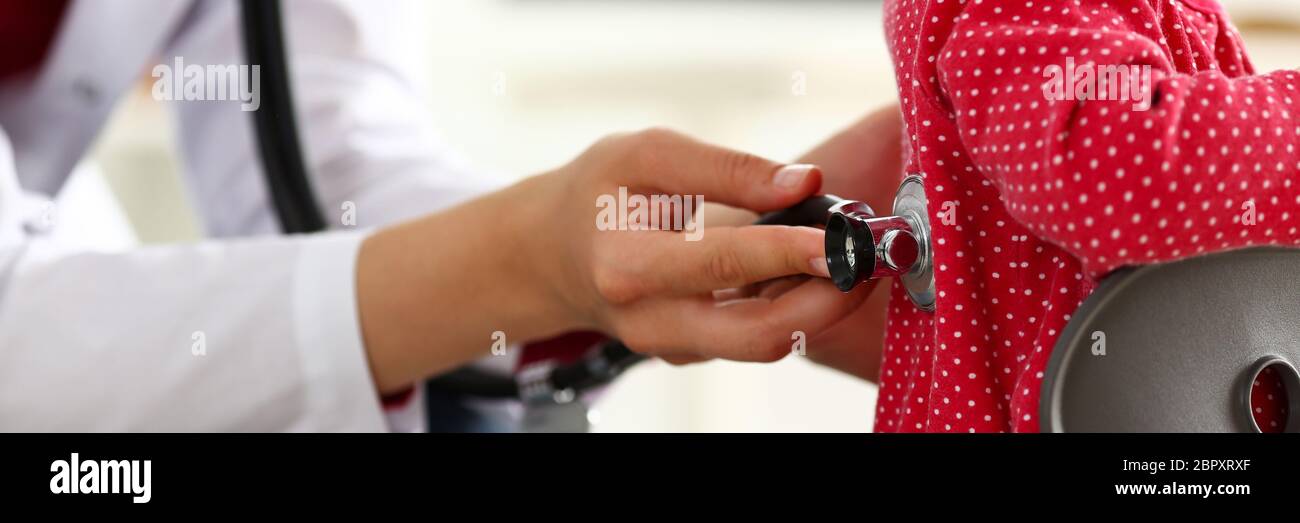 Little child with stethoscope at doctor reception Stock Photo - Alamy