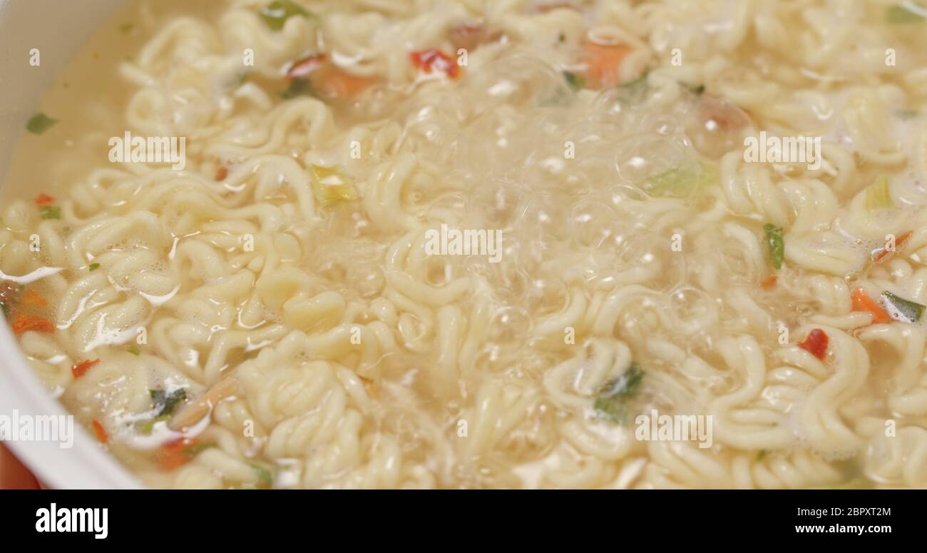 Cooking with instant noodles Stock Photo - Alamy