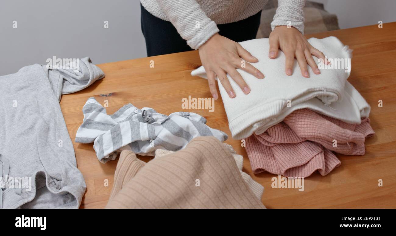 Fold clothes hi-res stock photography and images - Alamy