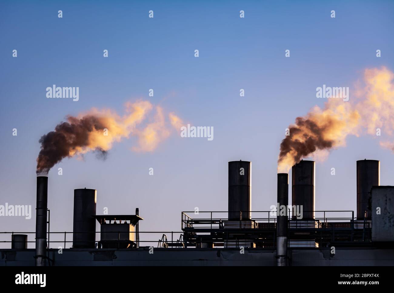 Smoke from industrial chimneys dawn hi-res stock photography and images ...