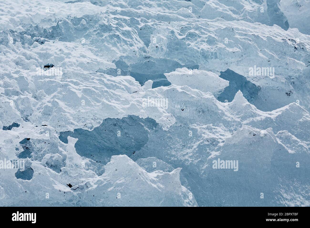 Ice blocks melting off an iceberg, icy shapes forming Stock Photo - Alamy