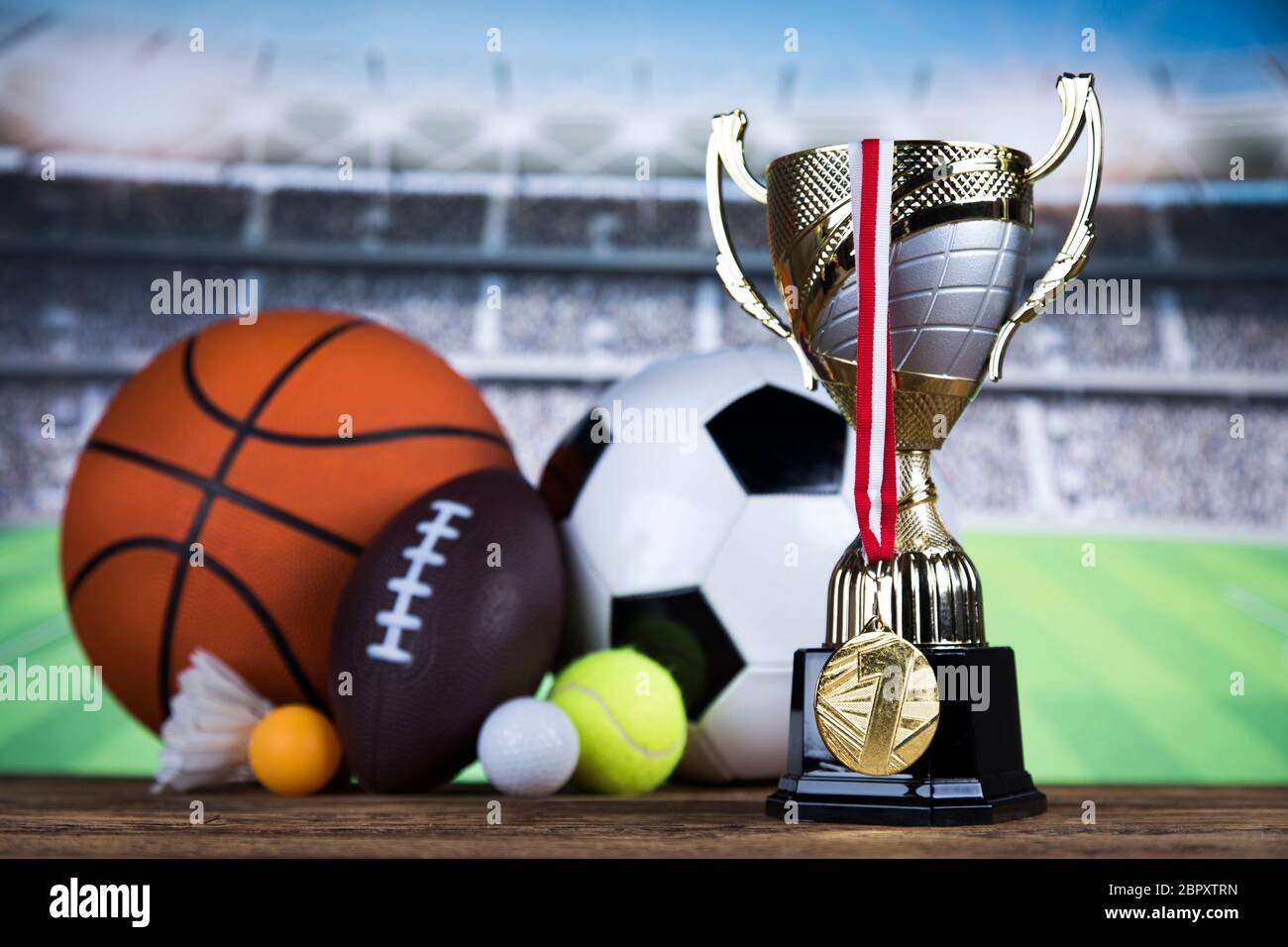 Winner trophy, Sport equipment and balls Stock Photo - Alamy