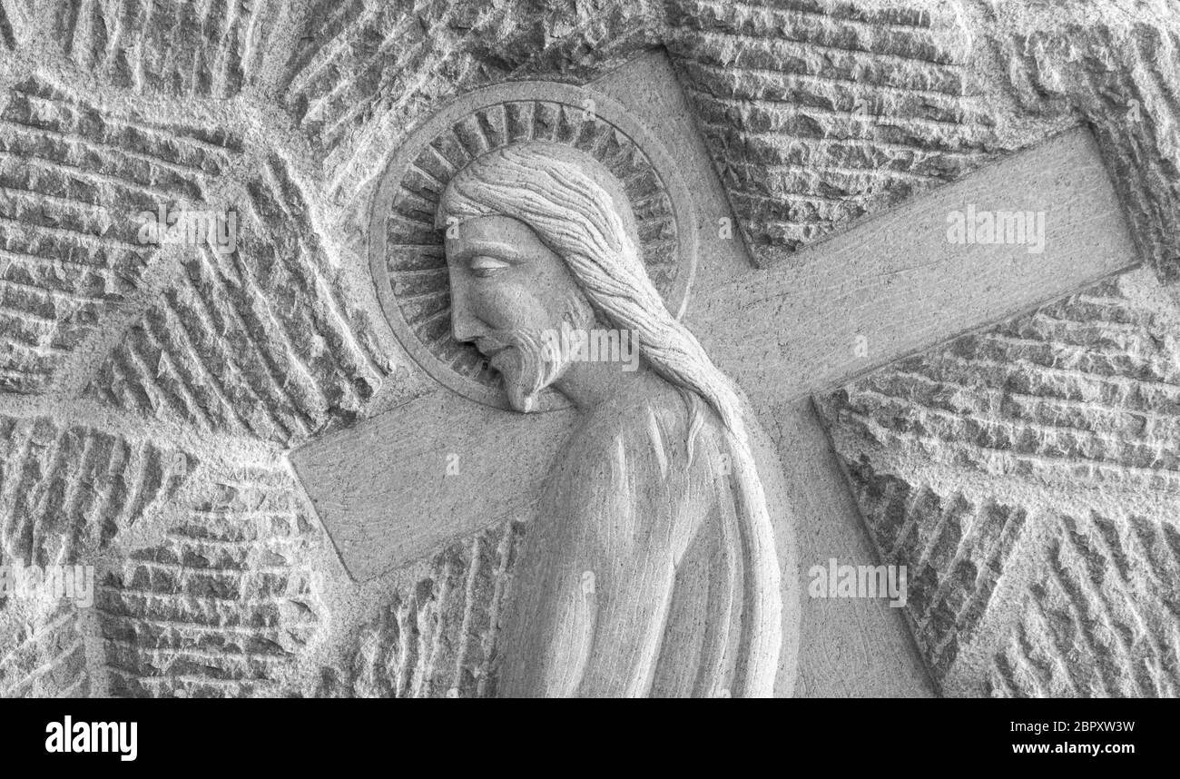 Bas relief of Jesus carrying his cross, on the way to his crucifixion ...