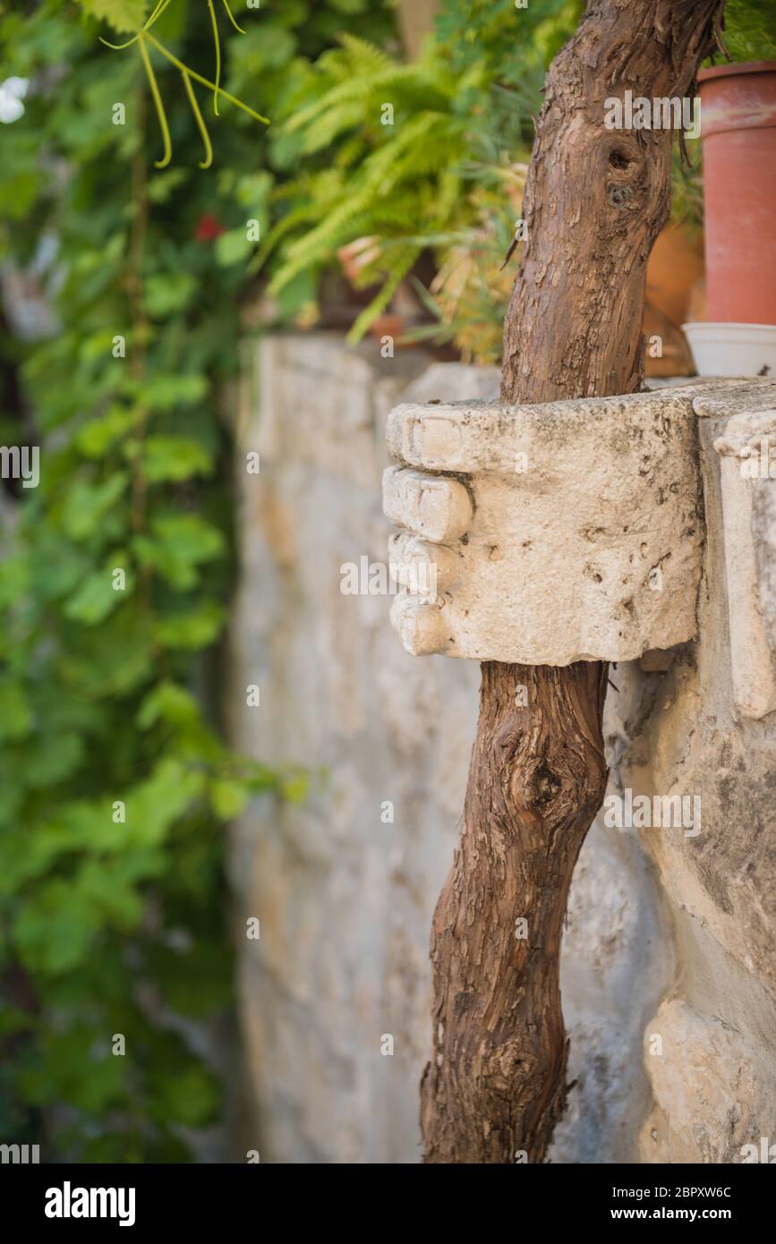 Ancient stone construction with tree trunk Stock Photo - Alamy