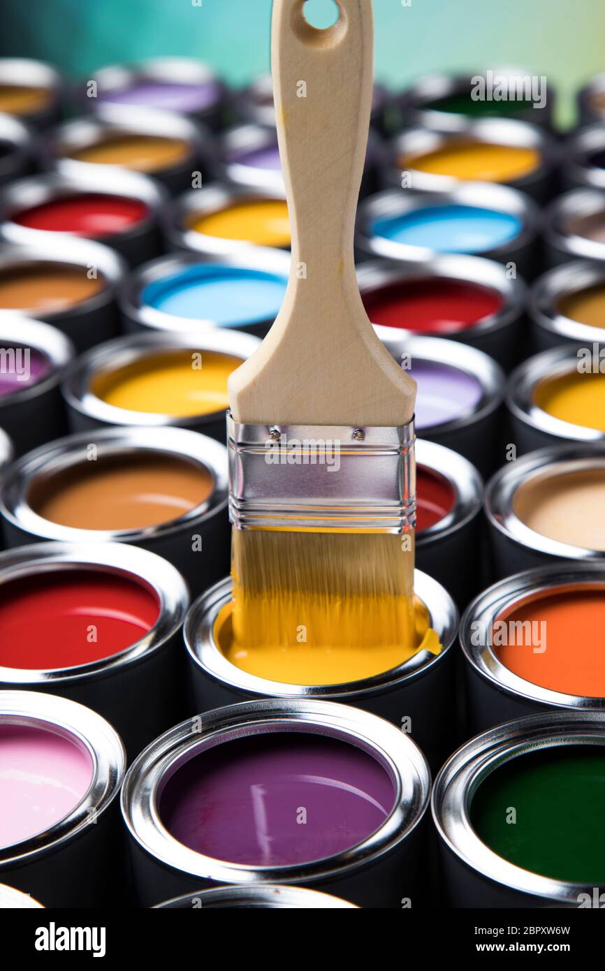 Metal tin cans with color paint and paintbrush Stock Photo - Alamy