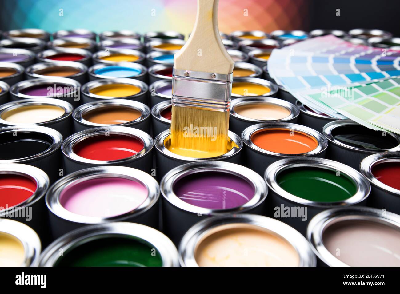 Metal tin cans with color paint and paintbrush Stock Photo - Alamy