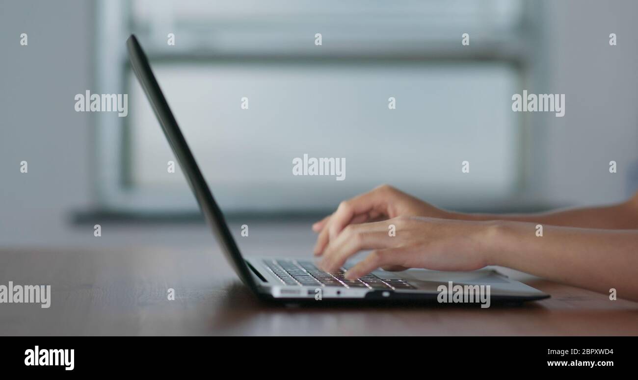 Type on laptop computer Stock Photo - Alamy