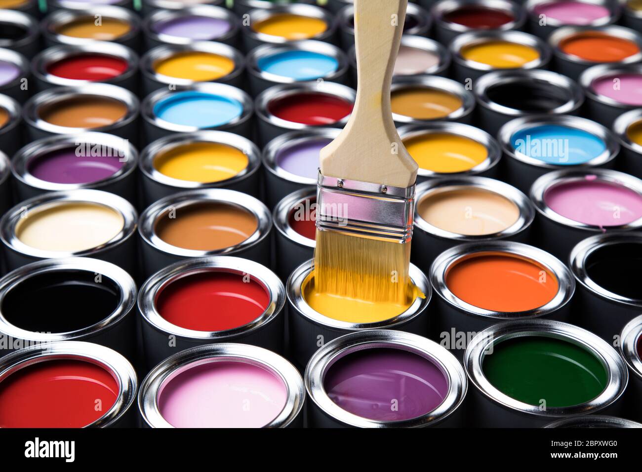 Metal tin cans with color paint and paintbrush Stock Photo - Alamy