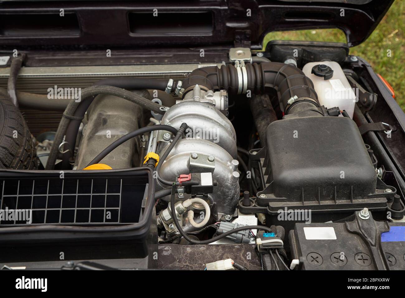 Car engine bay open hood Stock Photo - Alamy