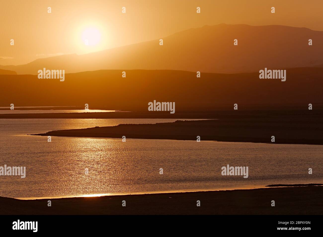 Sunset landscape with hills and lakes Stock Photo - Alamy