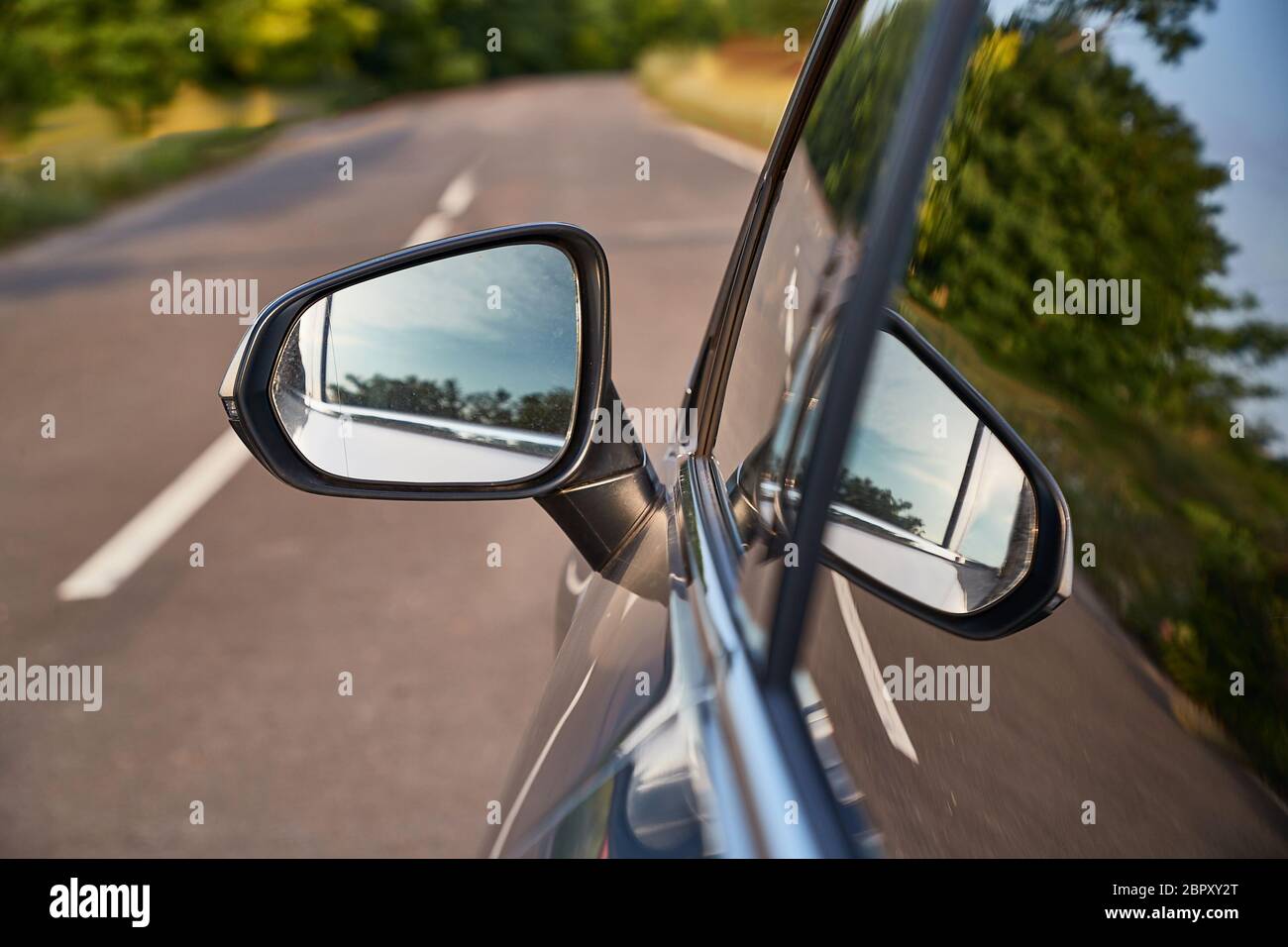 Car on the road, side detail Stock Photo - Alamy