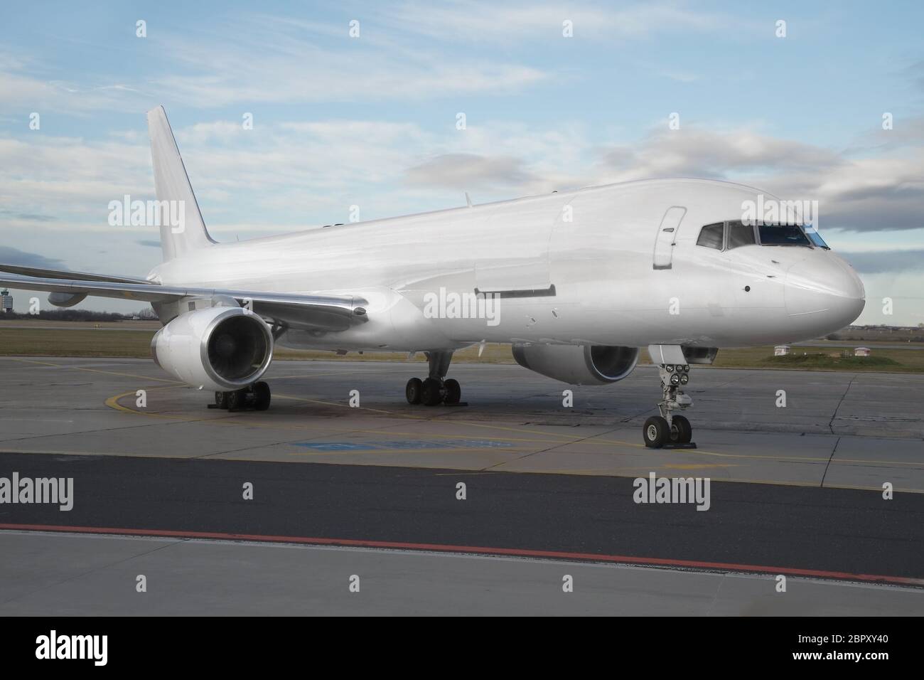 Cargo airplane parked at an airport, blank white body Stock Photo - Alamy
