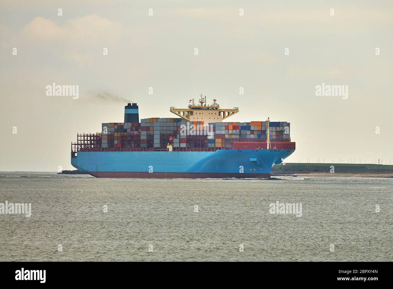 Container ship heading out on sea Stock Photo - Alamy