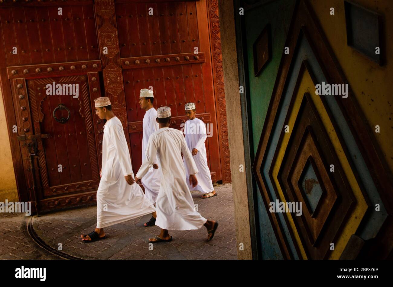 Nizwa, Oman. May 30th 2014 A group of young Omani men in traditional ...