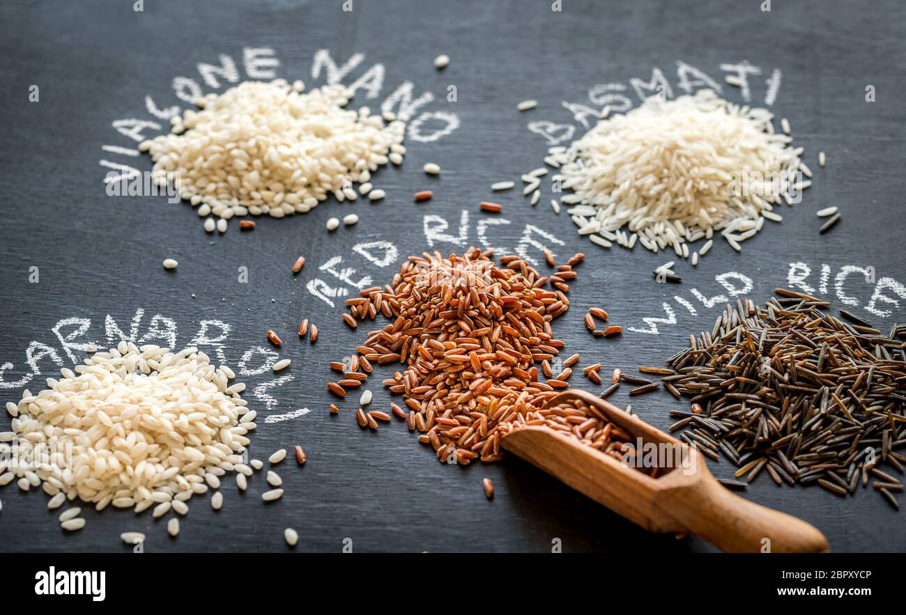 Different kinds of rice on the dark background Stock Photo - Alamy