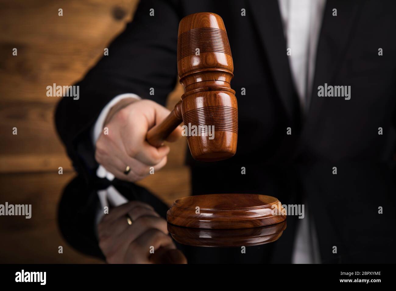 Justice and law concept, Male judge in a courtroom striking the gavel ...