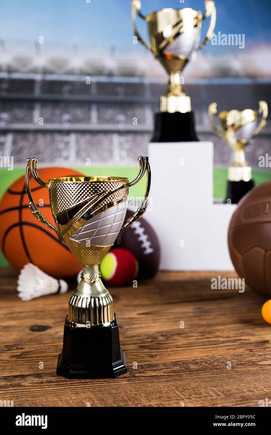 Winner trophy, Sport equipment and balls Stock Photo - Alamy