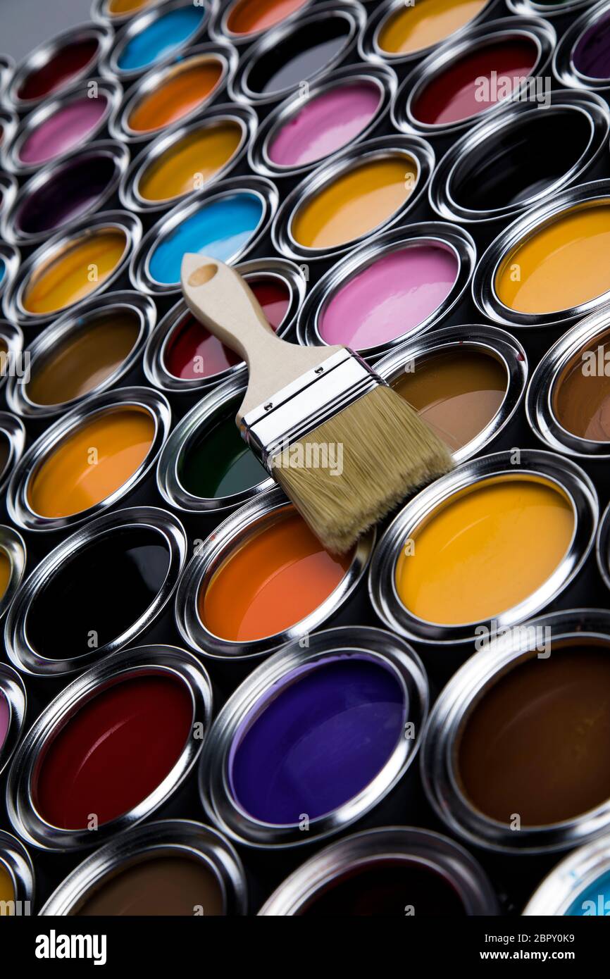 Metal tin cans with color paint and paintbrush Stock Photo - Alamy