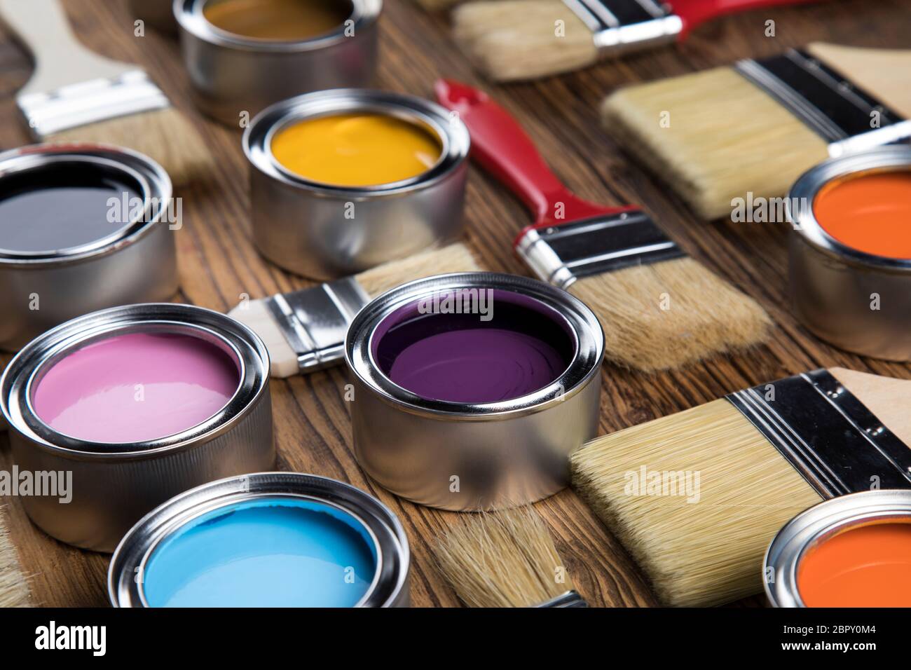 Tin cans with paint, brushes and bright palette of colors Stock Photo ...