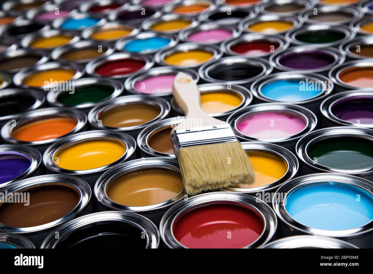 Metal tin cans with color paint and paintbrush Stock Photo - Alamy