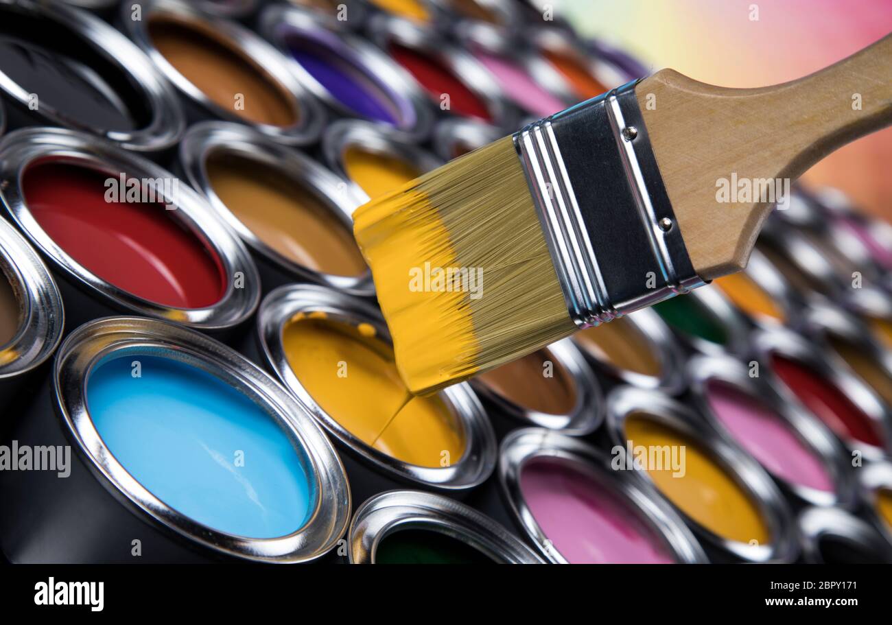 Metal tin cans with color paint and paintbrush Stock Photo - Alamy