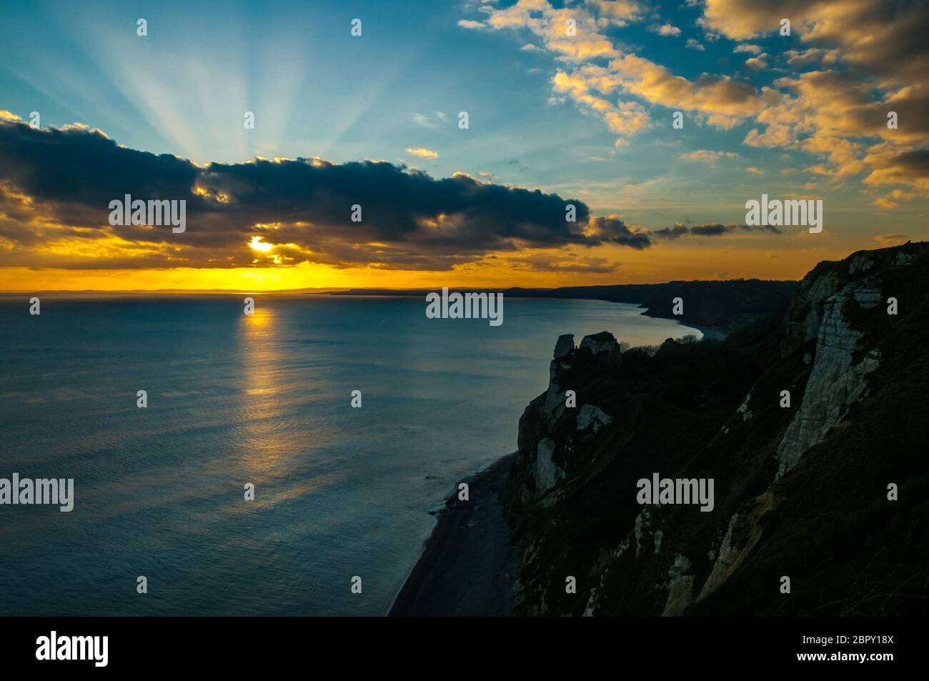 Sunset on the cliffs between Beer and Branscombe looking down at the ...