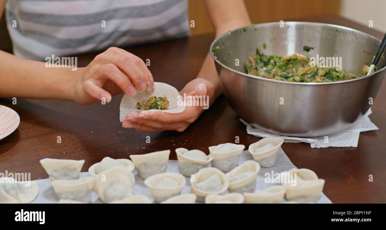 Woman make with chinese meat dumpling Stock Photo - Alamy