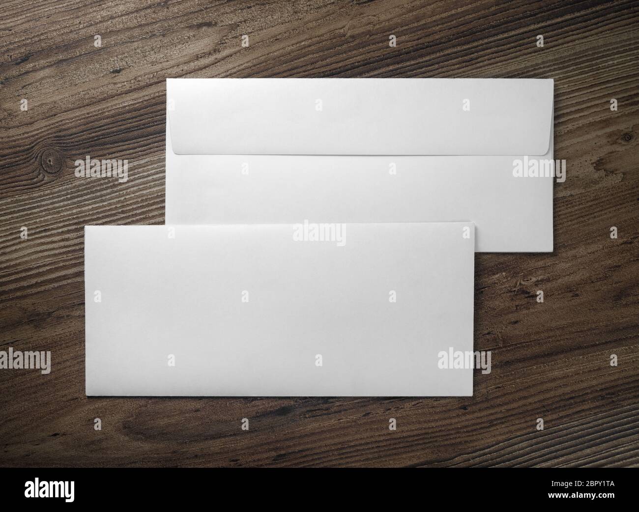 Two blank envelopes on wooden background. Front and back side. Flat lay ...