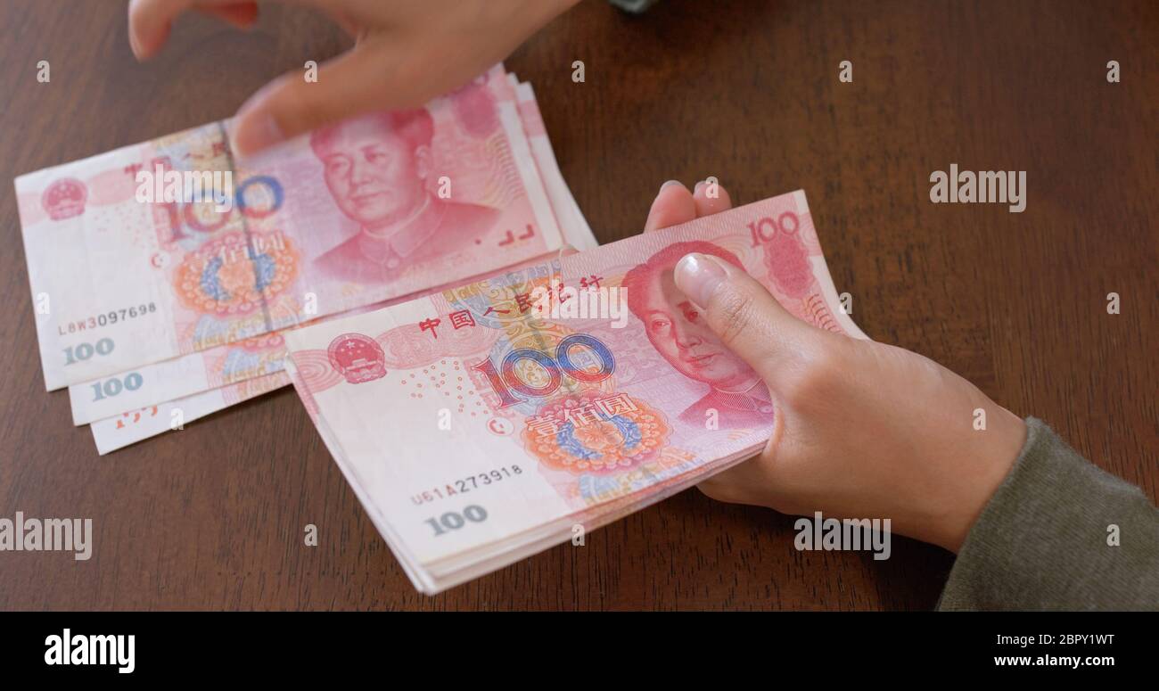 Woman counting rmb banknote hi-res stock photography and images - Alamy