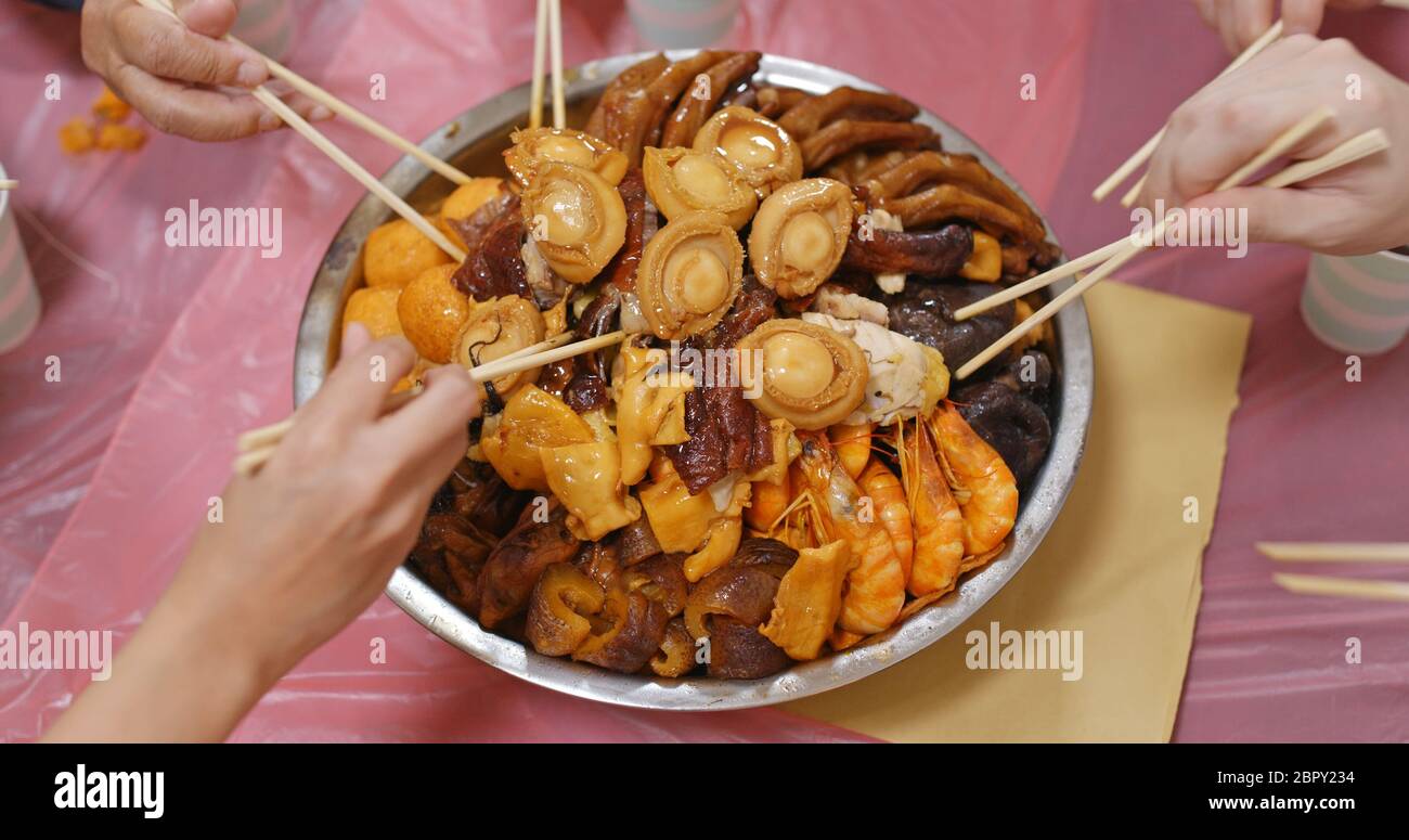 Traditional Chinese family eating big bowl feast together at home Stock ...
