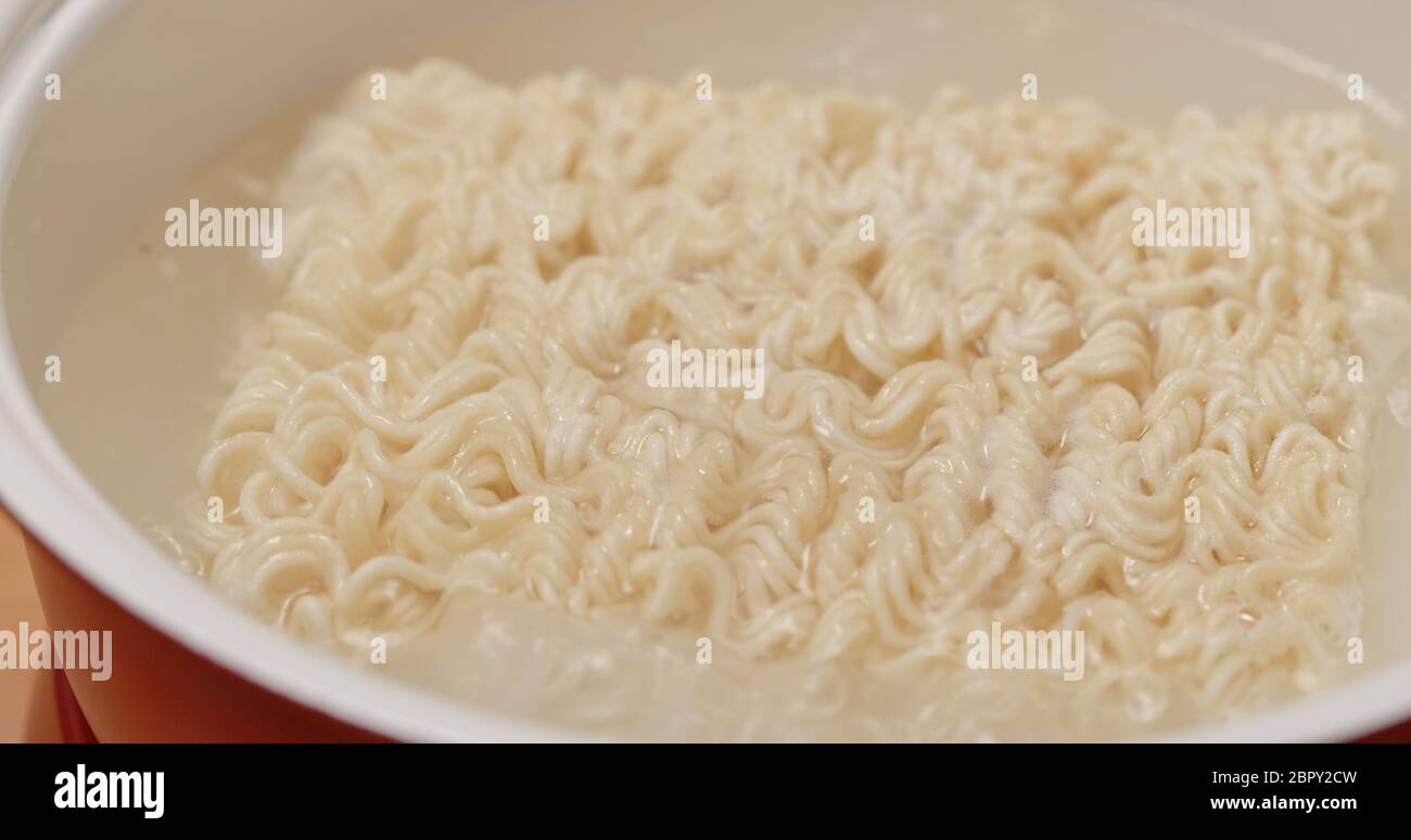 Cooking with instant noodles Stock Photo - Alamy
