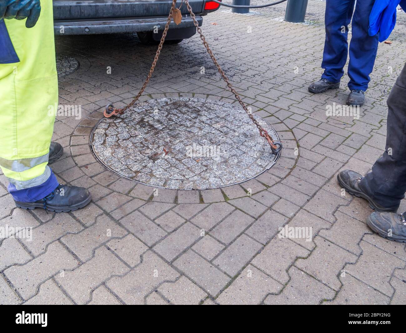 Manhole covers in the road hi-res stock photography and images - Alamy