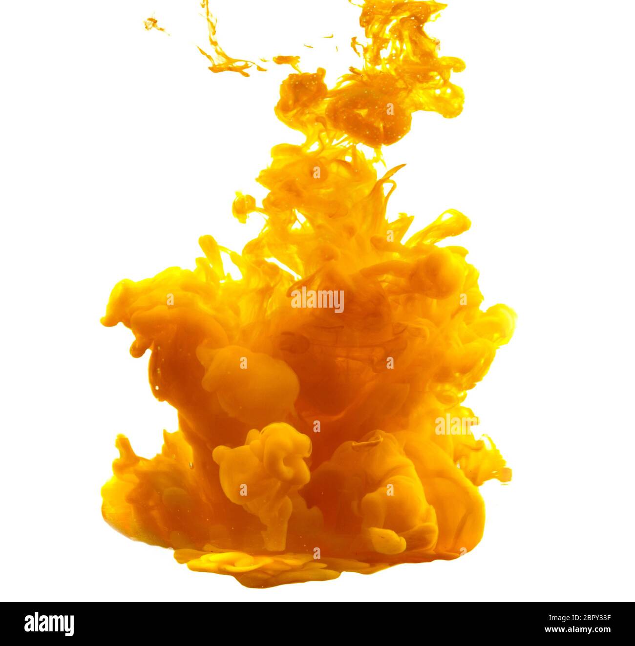Ink in water. Yellow ink splash Stock Photo - Alamy