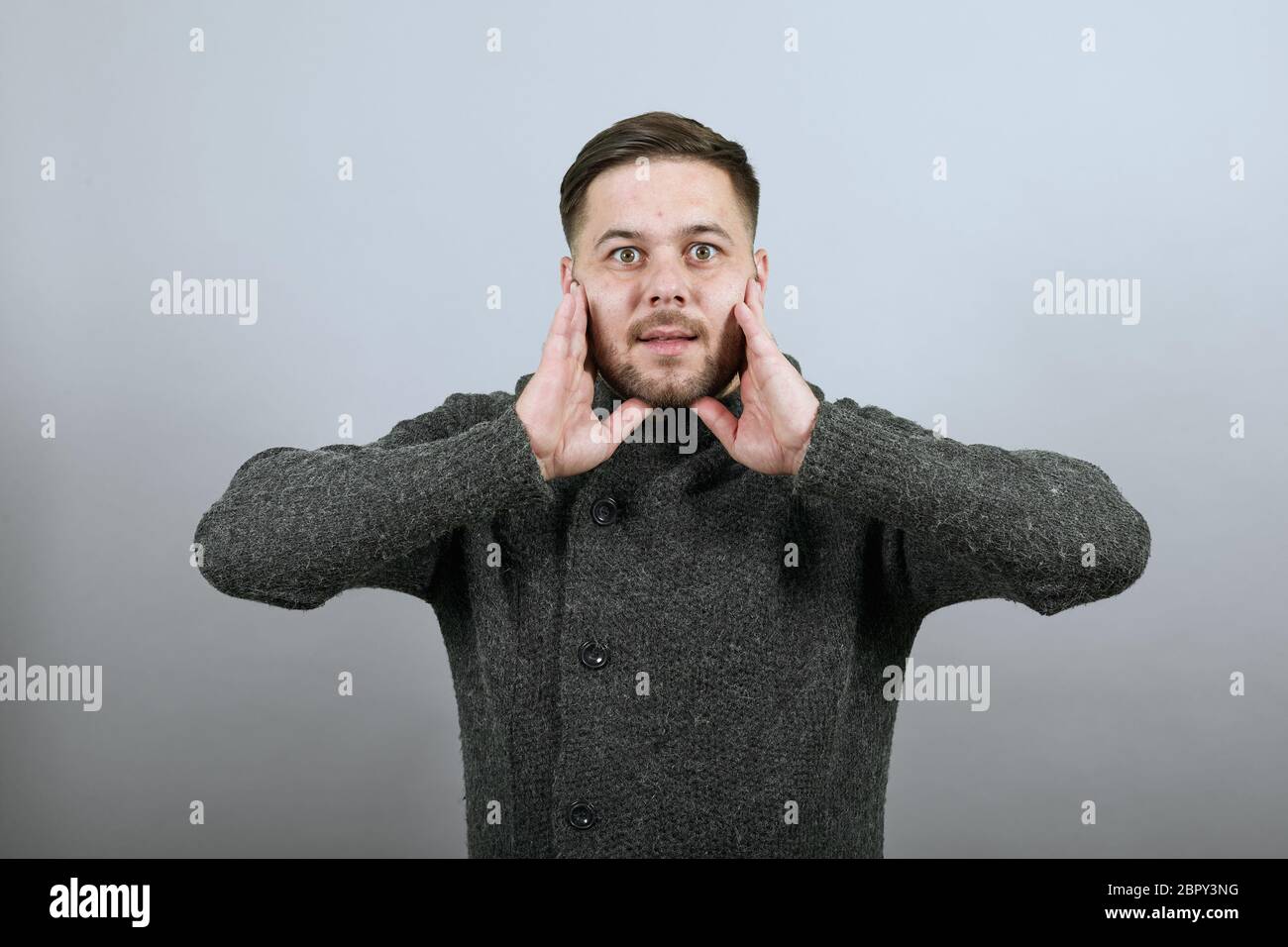 Confused Male Holds Hands To His Face. Shocked, Scared, Surprised ...