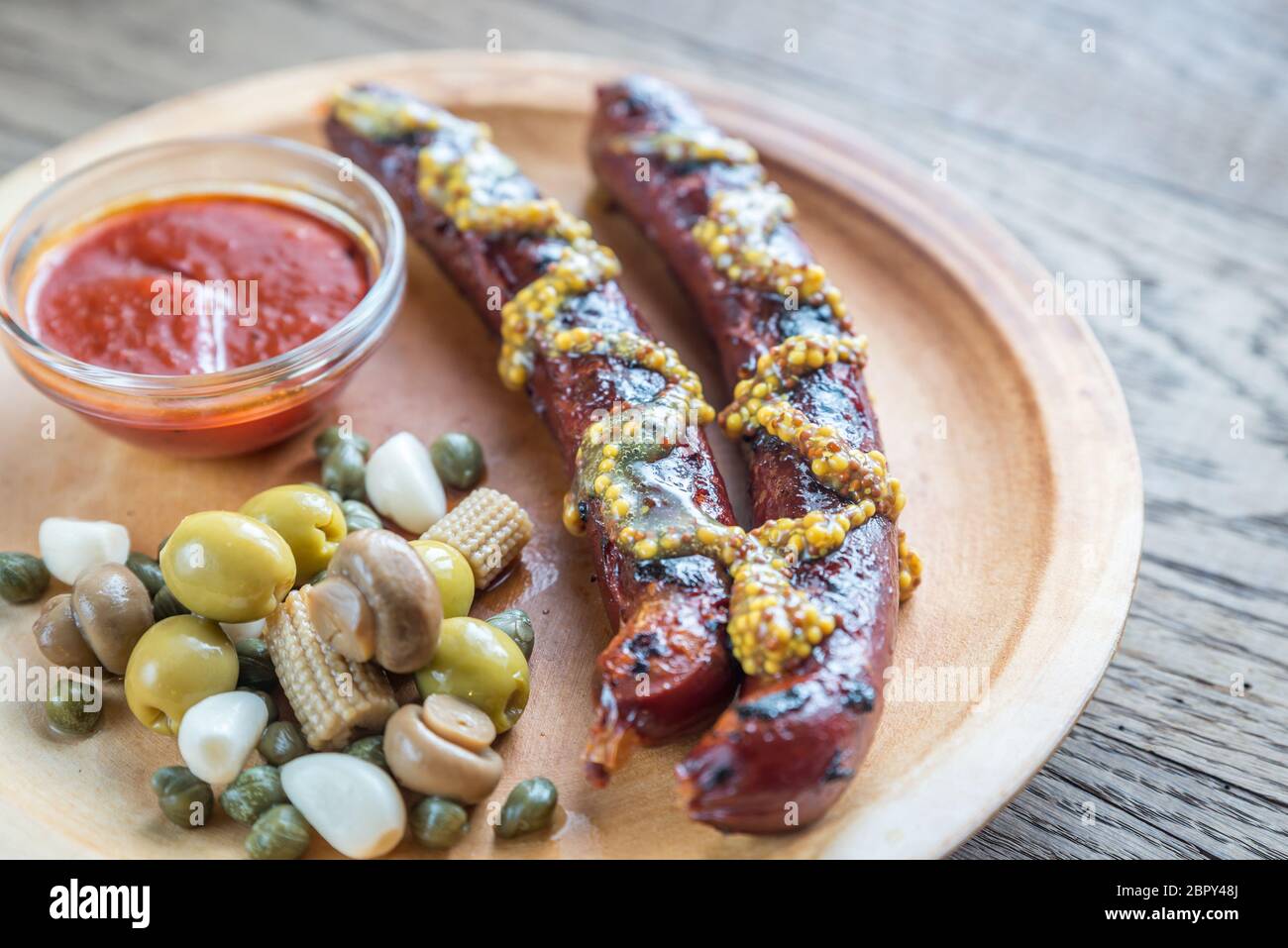 Grilled sausages on the plate Stock Photo - Alamy
