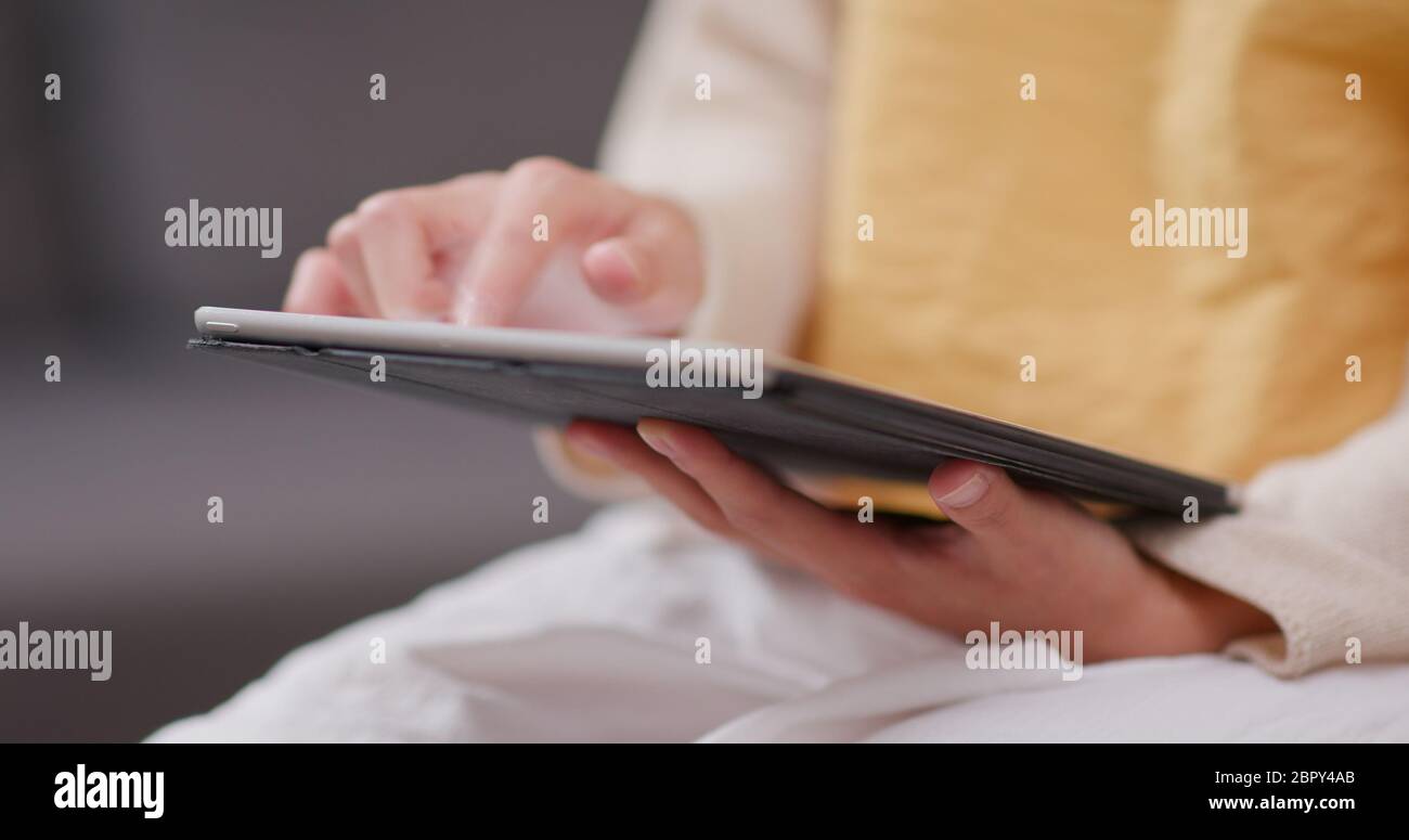 Woman use of tablet computer Stock Photo - Alamy