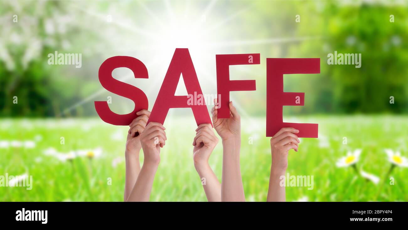 People Hands Holding Word Safe, Grass Meadow Stock Photo - Alamy