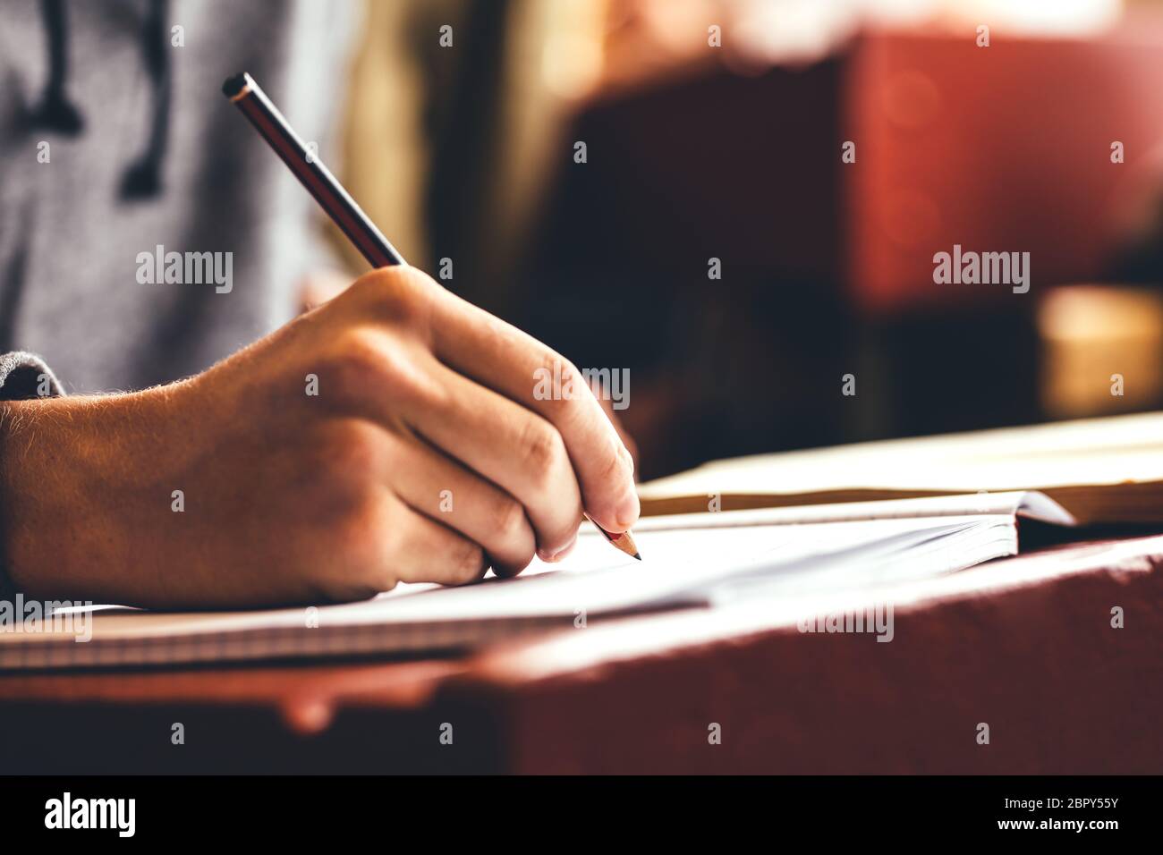 Male student book pen hi-res stock photography and images - Alamy