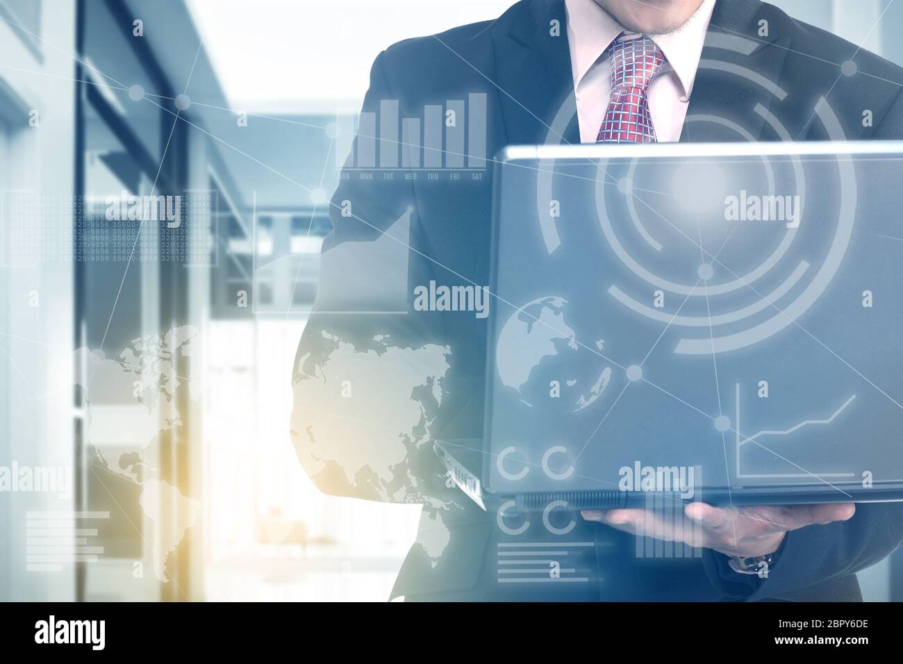 Businessman holding laptop with his hand with virtual screen which ...